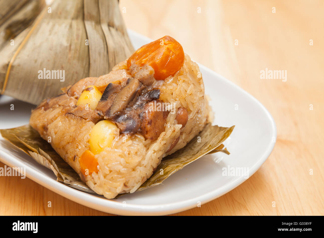 Zongzi is a traditional Chinese food, made of glutinous rice stuffed ...