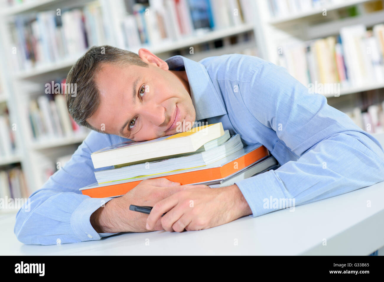 man with books Stock Photo - Alamy
