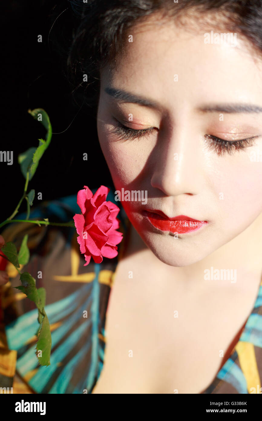 Asian girls are making up face feature Stock Photo - Alamy