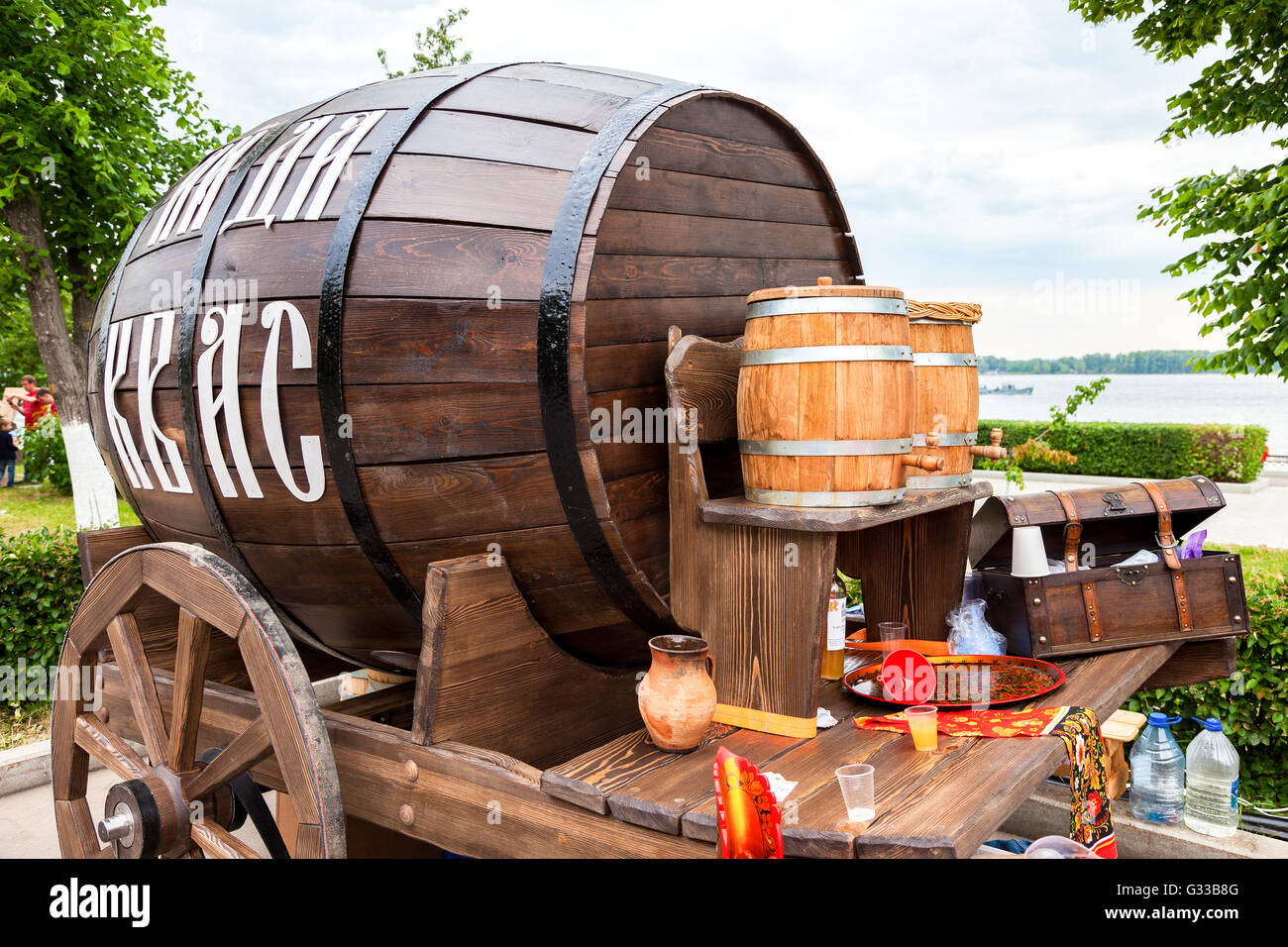 Sale traditional Russian kvass from wooden barrels at the city ...