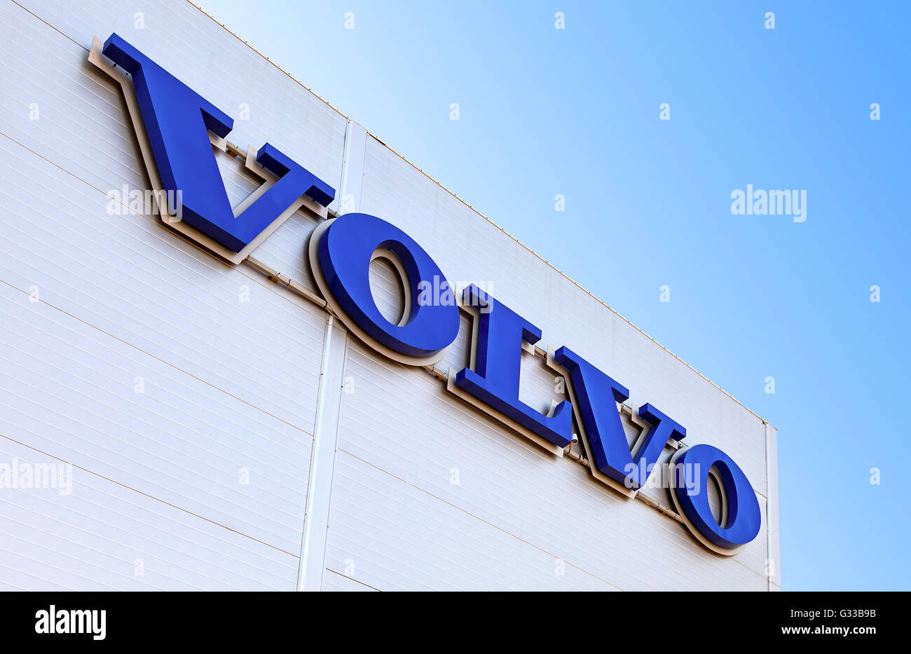 Volvo dealership sign against the blue sky. Volvo is a Swedish ...