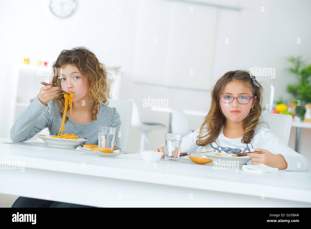 Young girls having lunch Stock Photo - Alamy