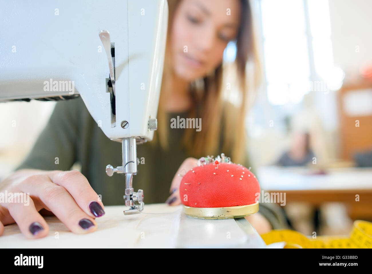 Seamstress in the design studio Stock Photo - Alamy