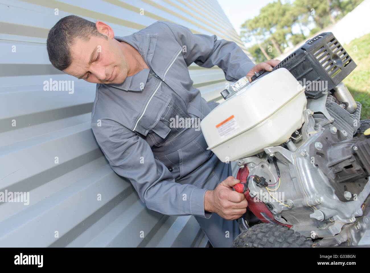 man with a portable motor Stock Photo - Alamy