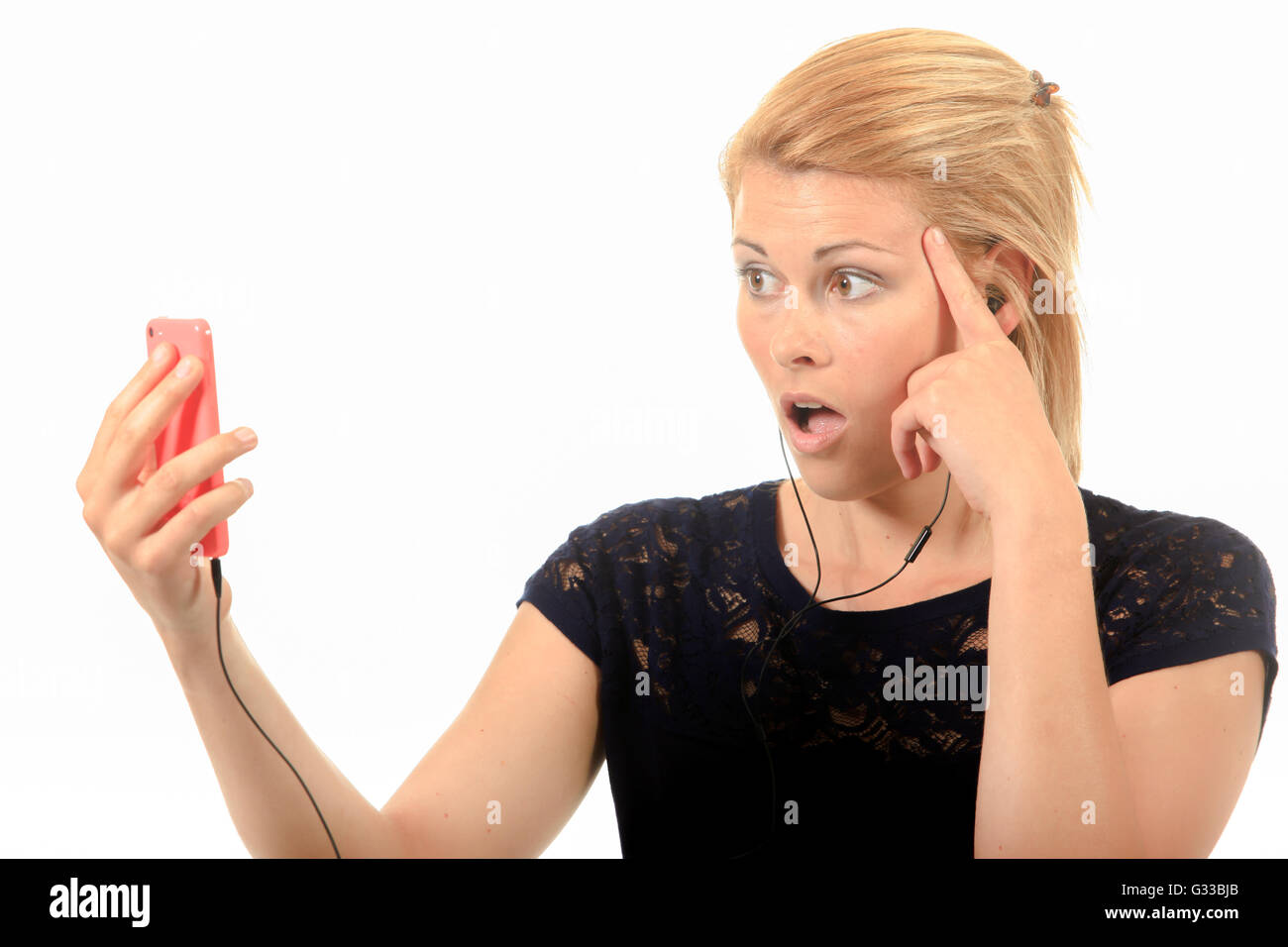 Woman shocked by a text message Stock Photo - Alamy