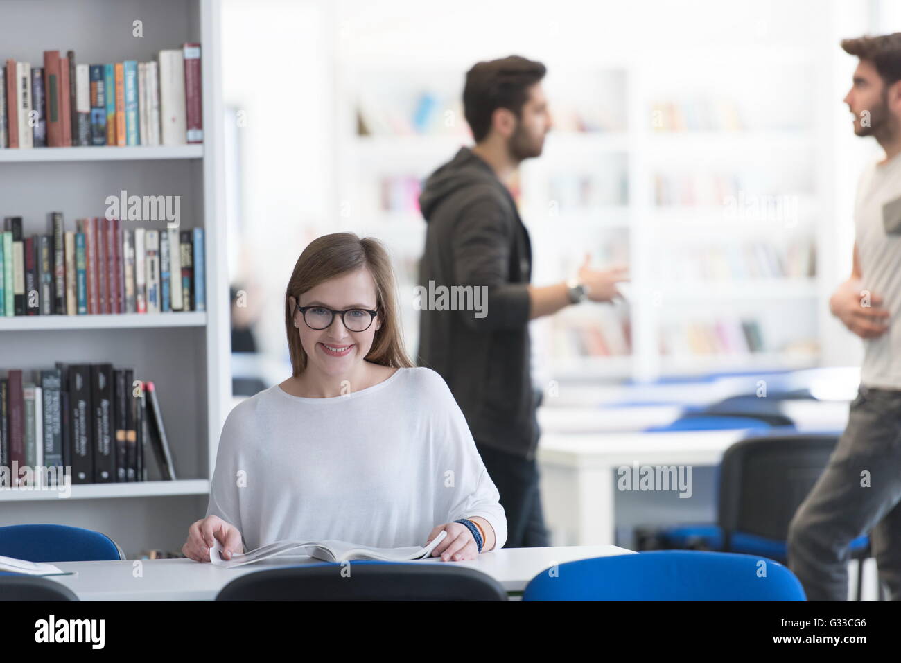 female smart looking student study in school library, group of students ...