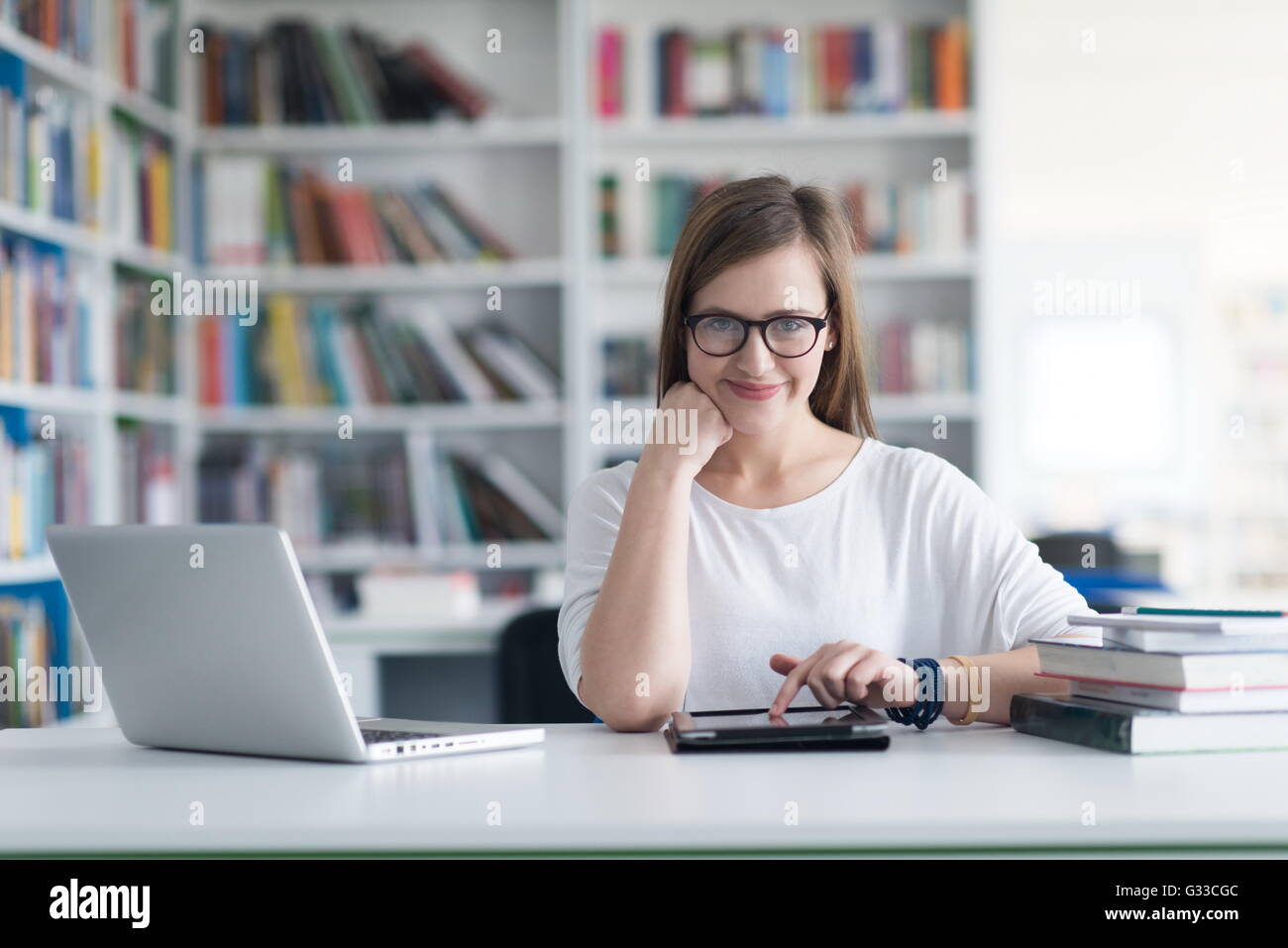 female student study in school library, using laptop and searching for ...