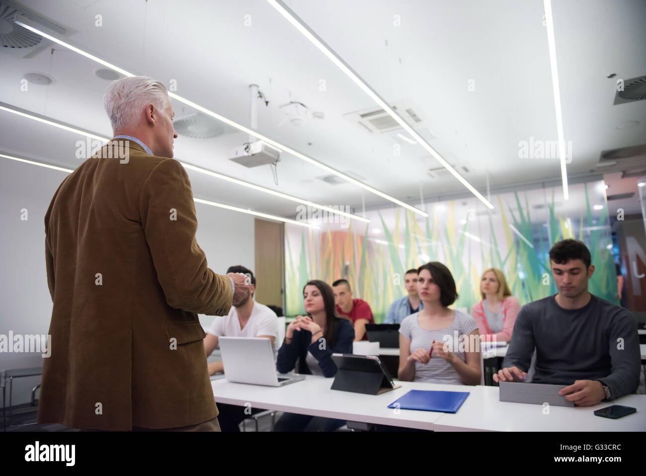 group of students study with professor in modern school classroom Stock ...