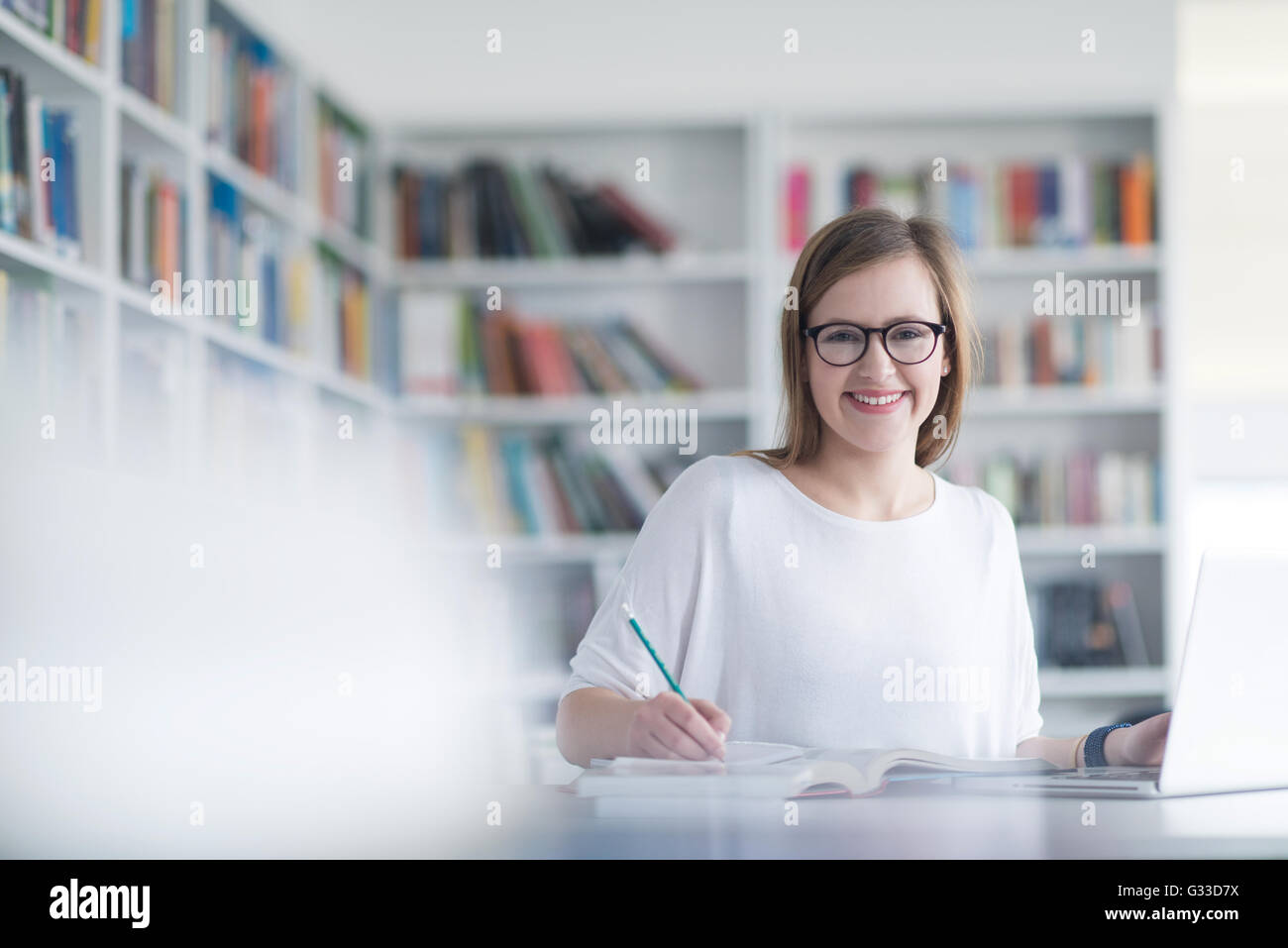 female student study in school library, using laptop and searching for ...