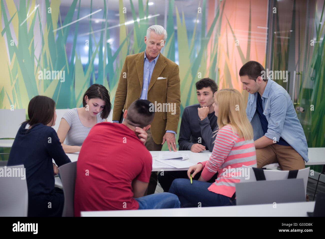 group of students study with professor in modern school classroom Stock ...