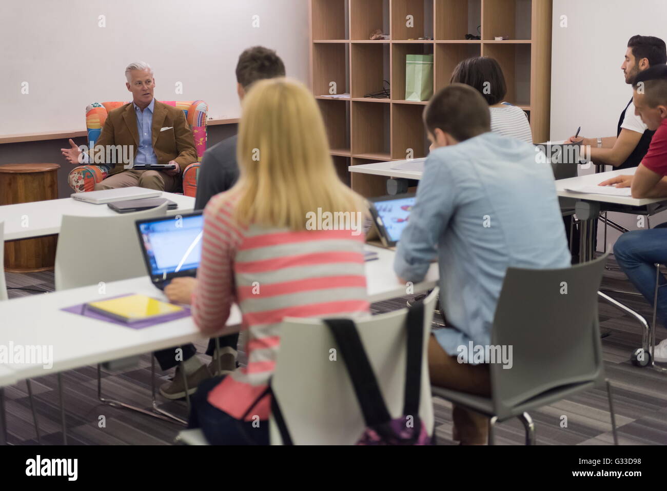 group of students study with professor in modern school classroom Stock ...