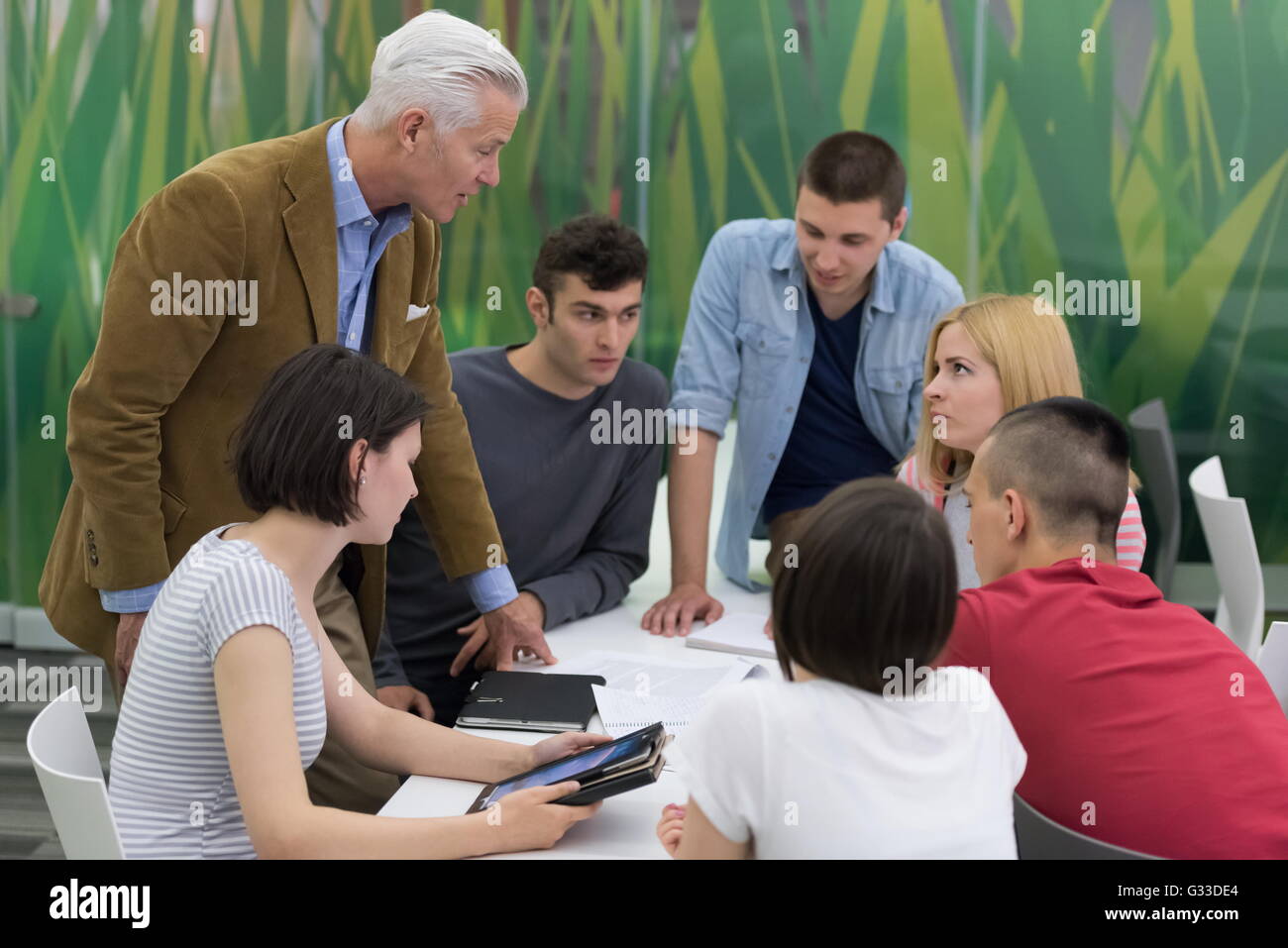 group of students study with professor in modern school classroom Stock ...