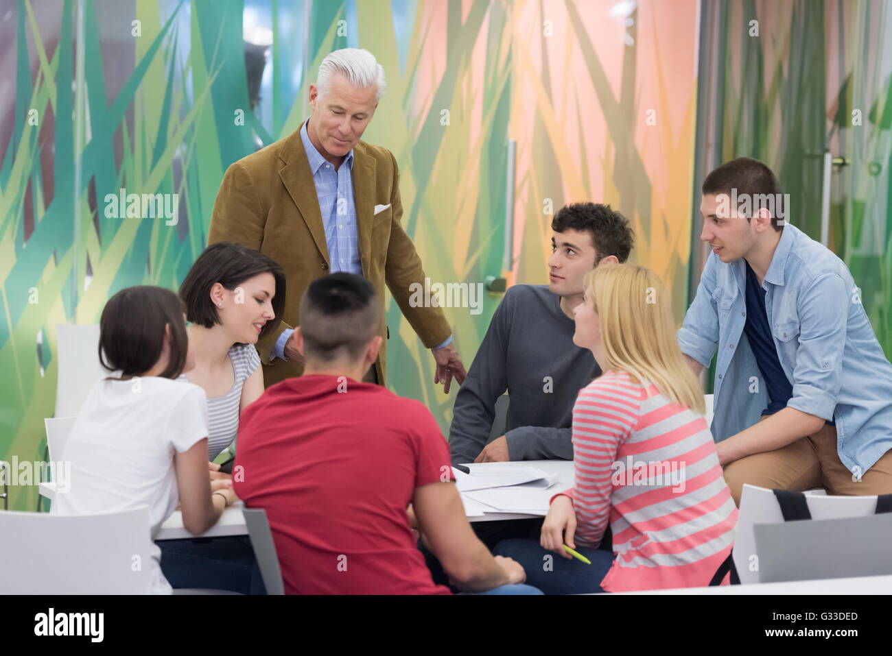 group of students study with professor in modern school classroom Stock ...
