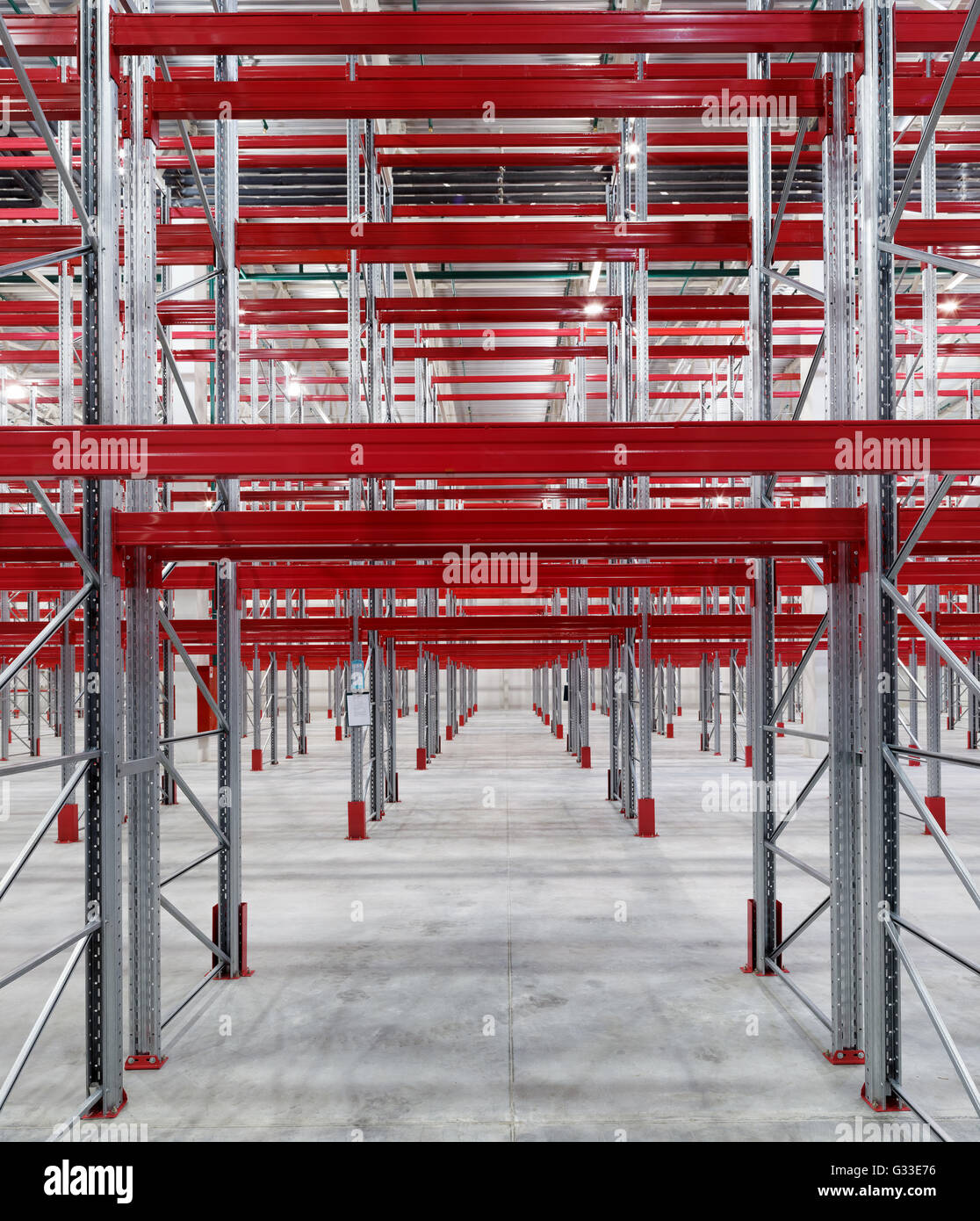 Industrial racks pallets shelves in huge empty warehouse interior ...