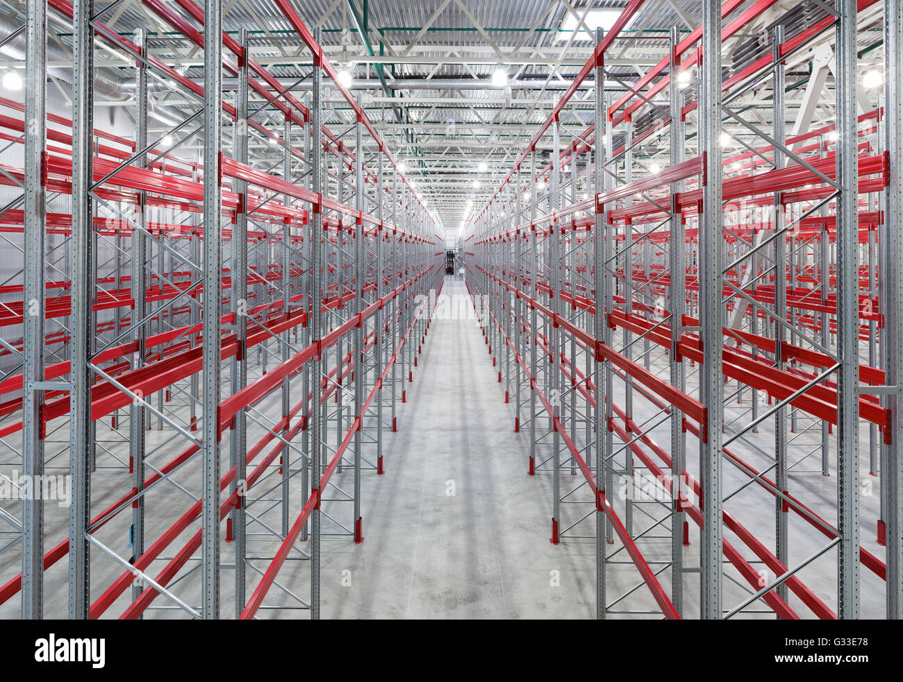 Industrial racks pallets shelves in huge empty warehouse interior ...