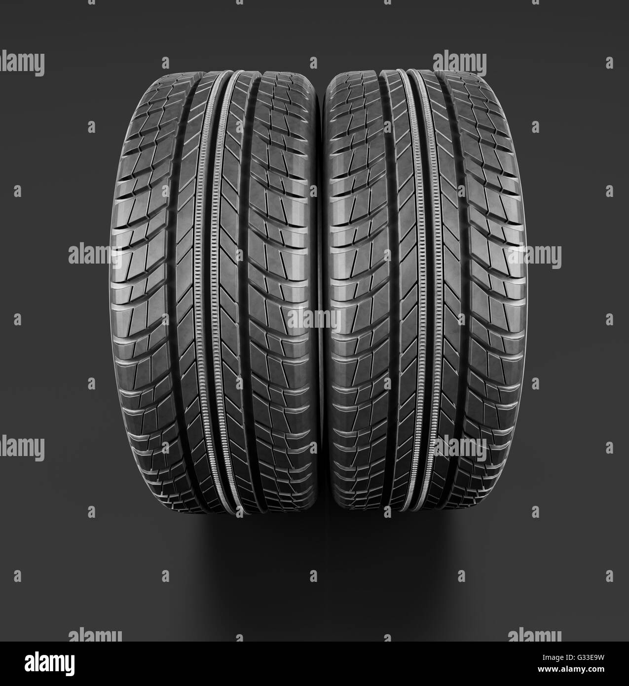 Two new car tires close up on black background. Include clipping path ...