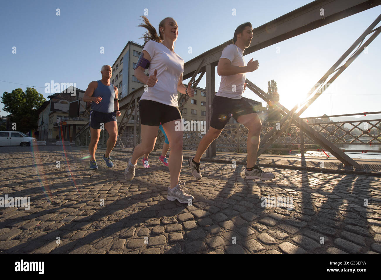 people group jogging runners team on morning training workout with ...