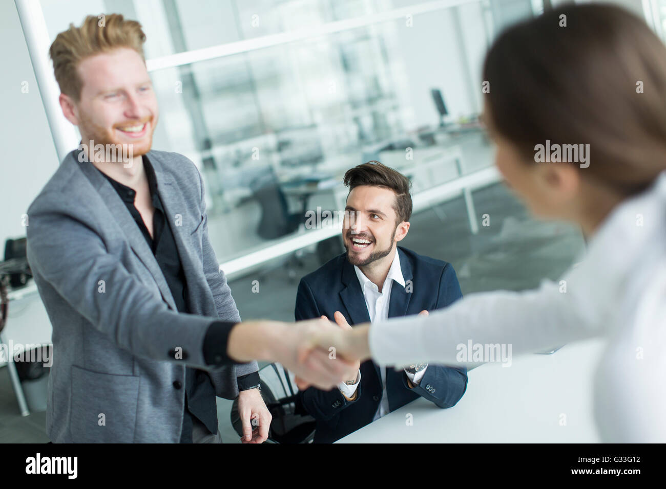 Business people shaking hands in the office Stock Photo - Alamy
