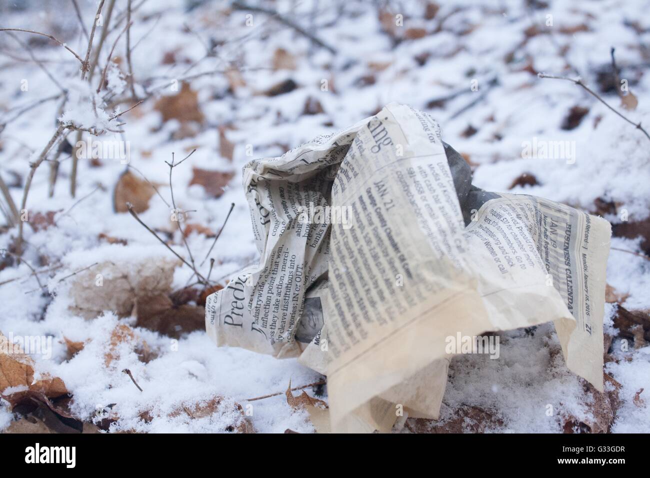 Newspaper in the snow Stock Photo - Alamy
