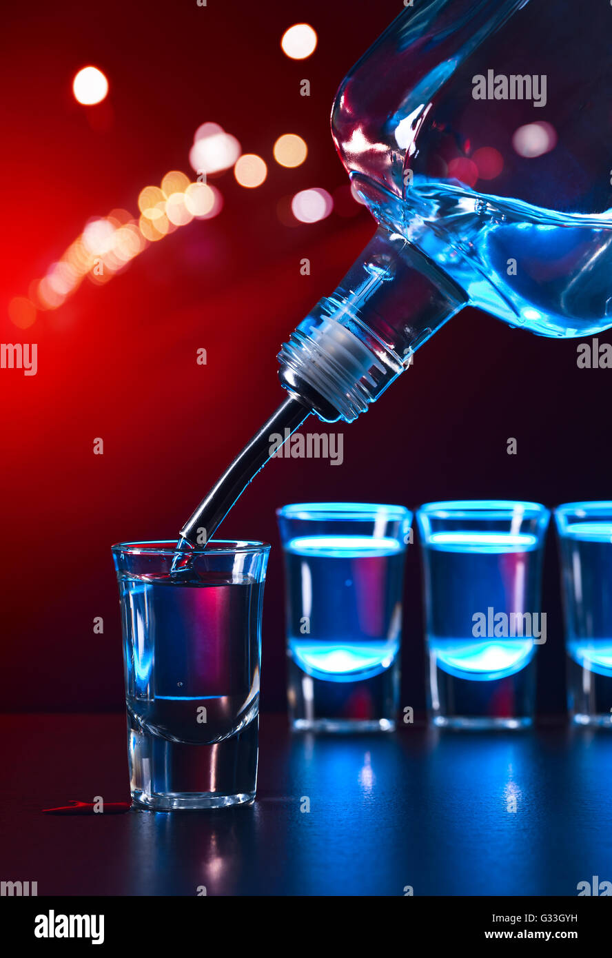 vodka in bar on a black table Stock Photo - Alamy