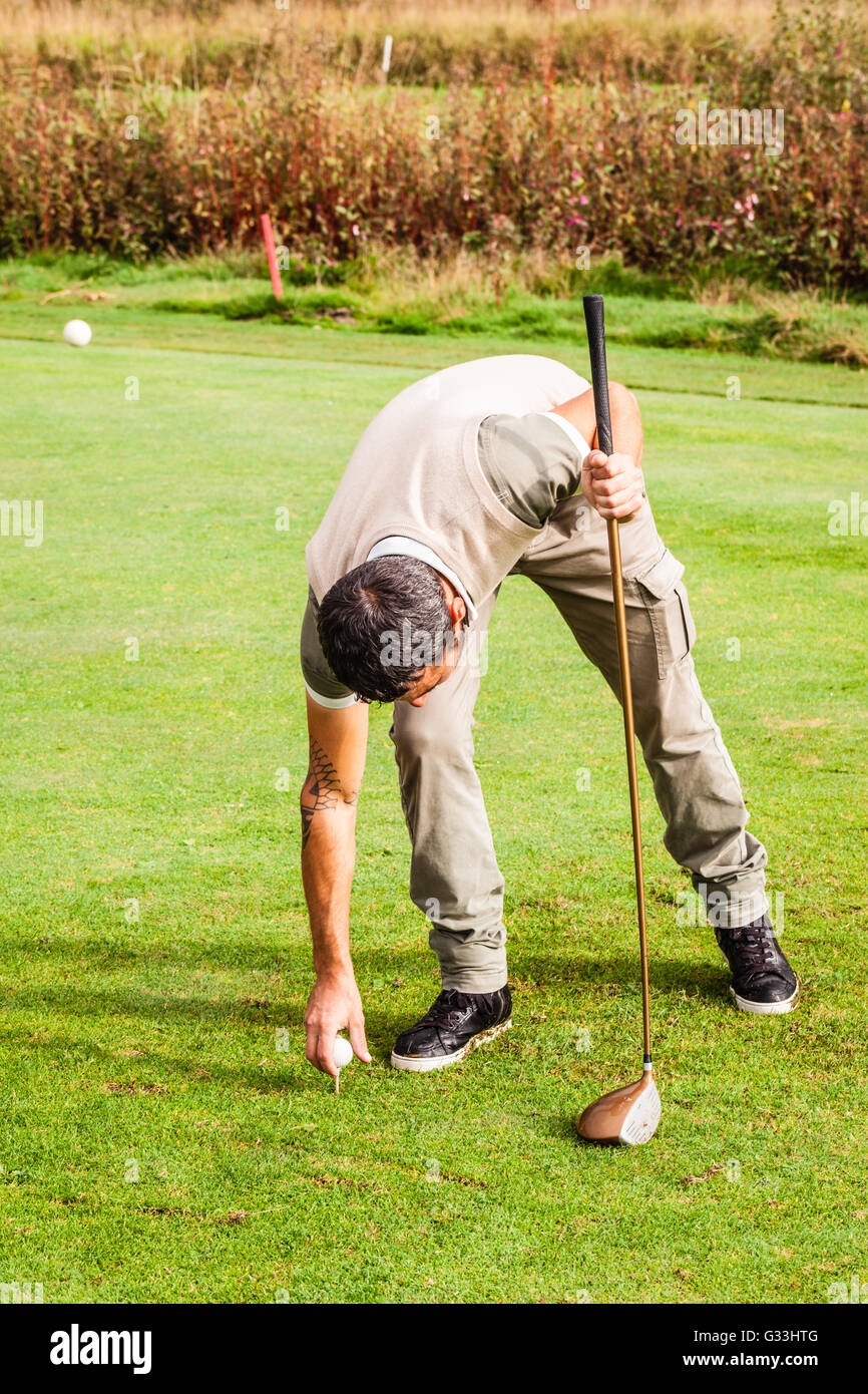 detail of a driver club and a golf ball on a golf course Stock Photo ...