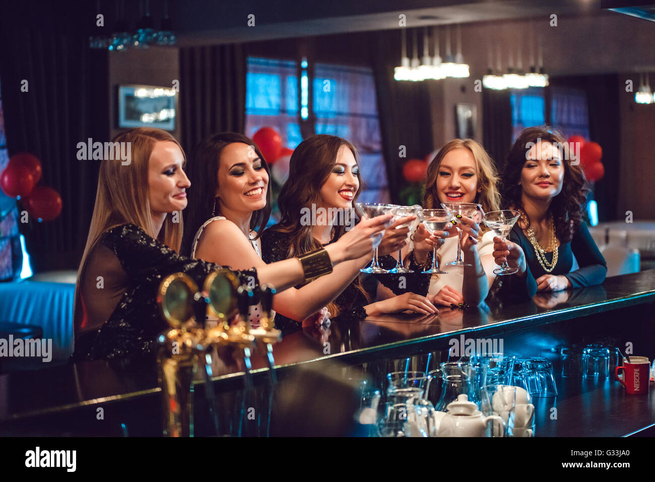 Beautiful girls having fun at a party in nightclub Stock Photo - Alamy