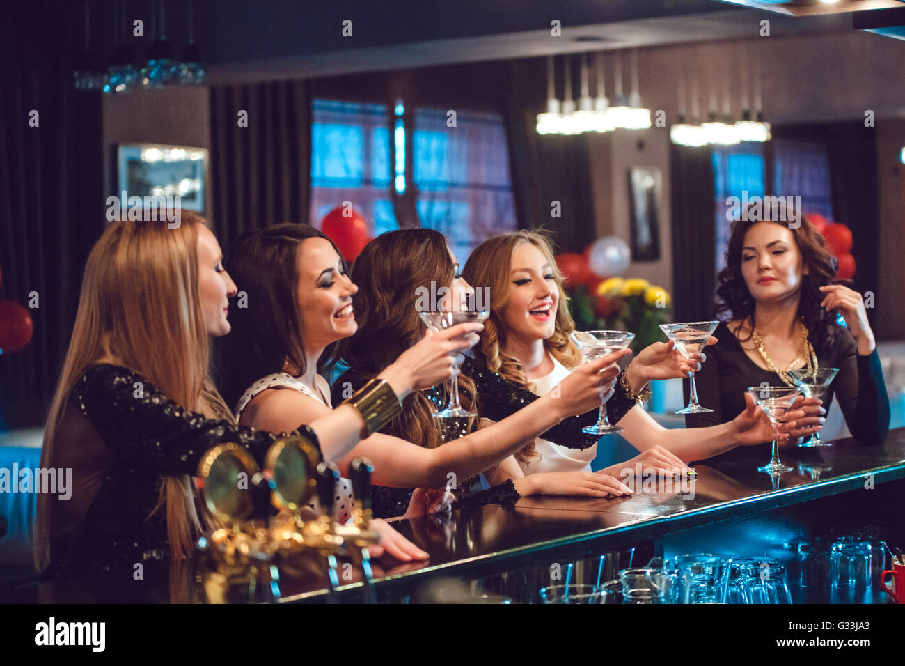 Beautiful girls having fun at a party in nightclub Stock Photo - Alamy