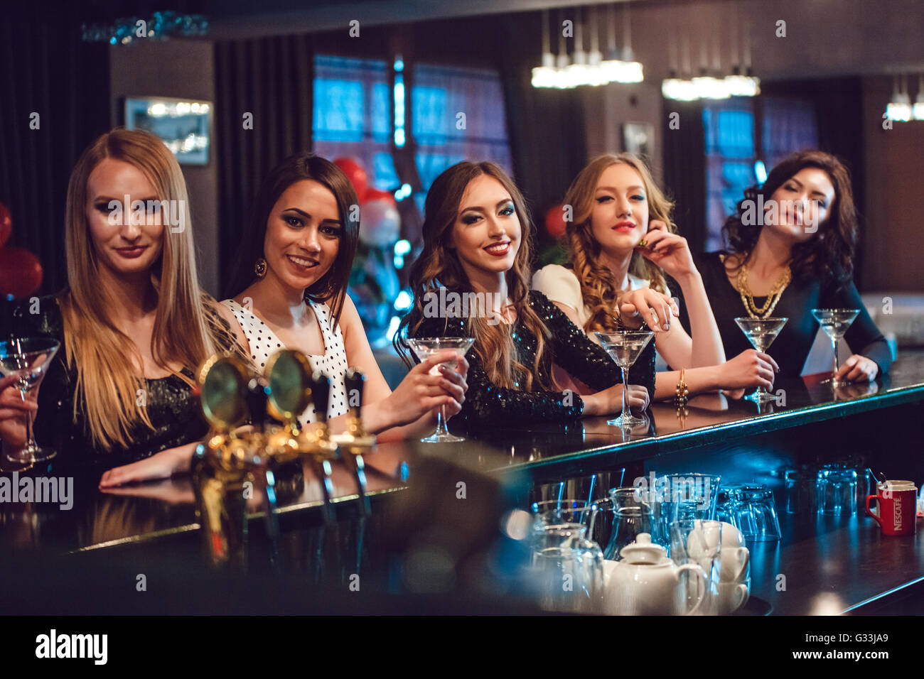 Beautiful girls having fun at a party in nightclub Stock Photo - Alamy