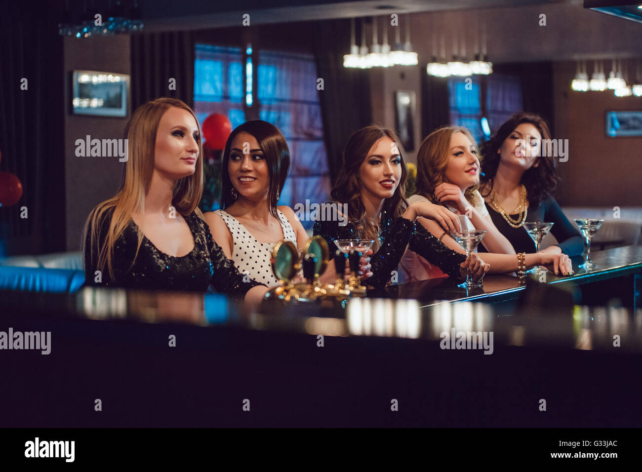 Beautiful girls having fun at a party in nightclub Stock Photo - Alamy