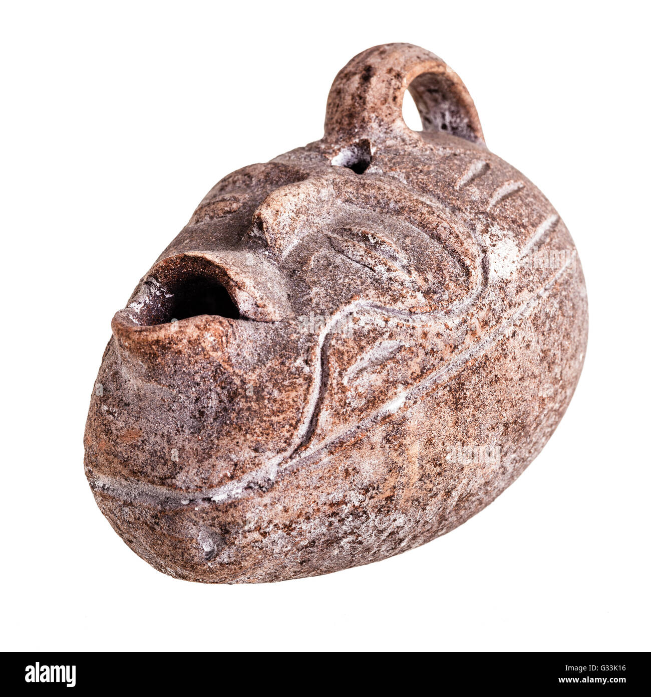 an ancient terracotta vase or jug shaped like a human face isolated ...