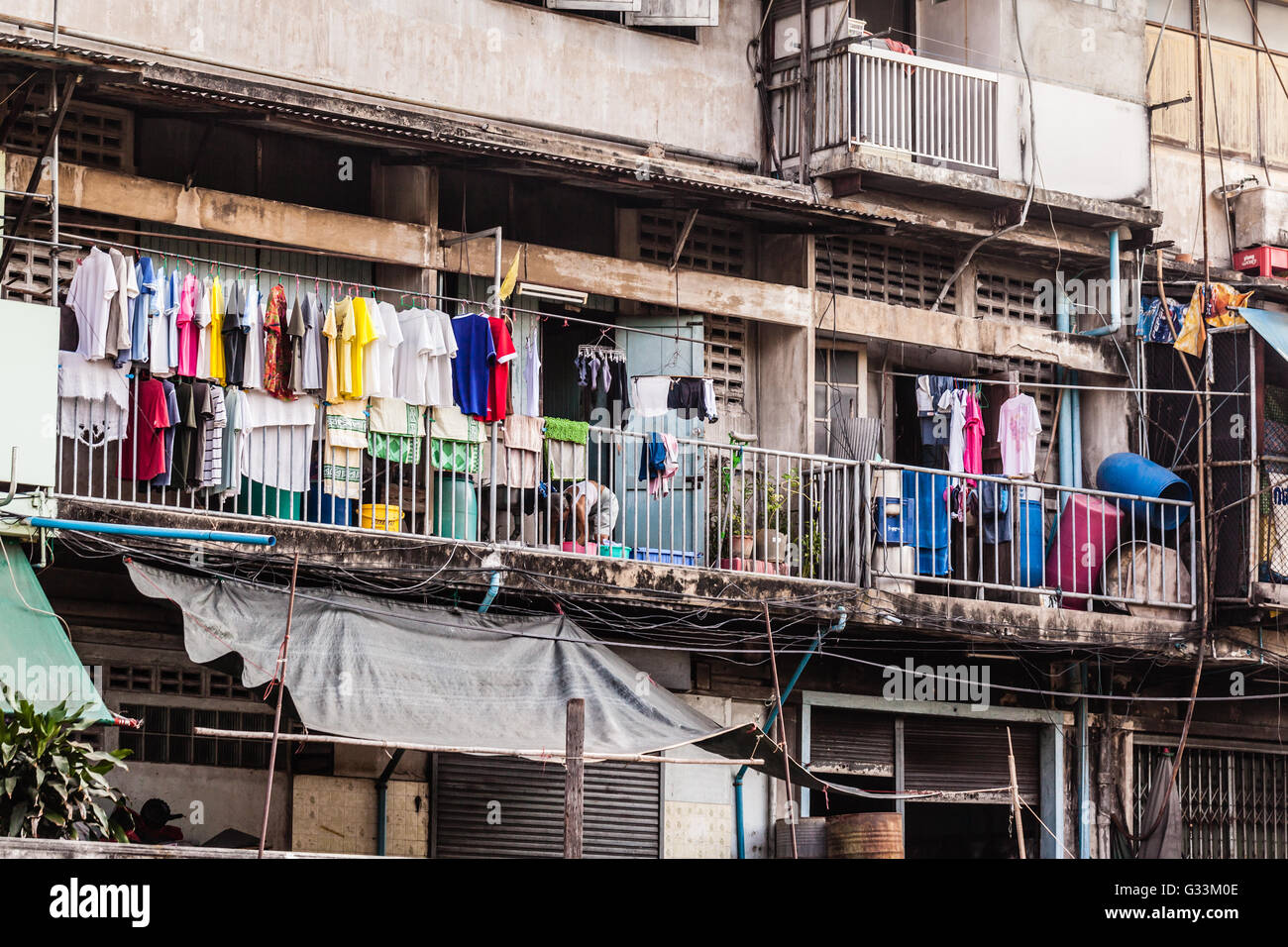 Wooden slums on stilts on the riverside of Chao Praya River in Bangkok ...