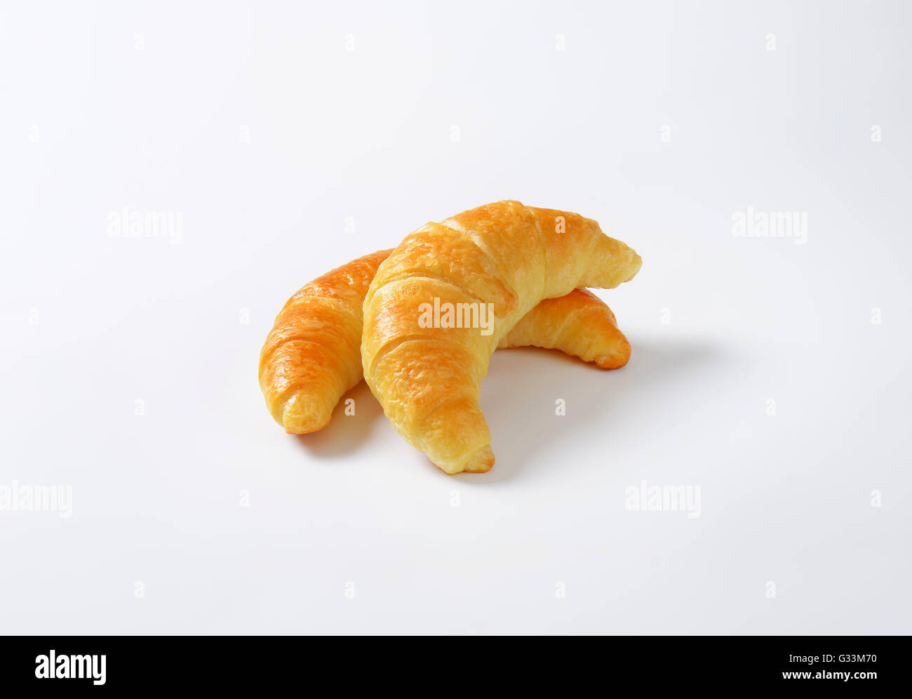 two jam filled croissants on white background Stock Photo - Alamy