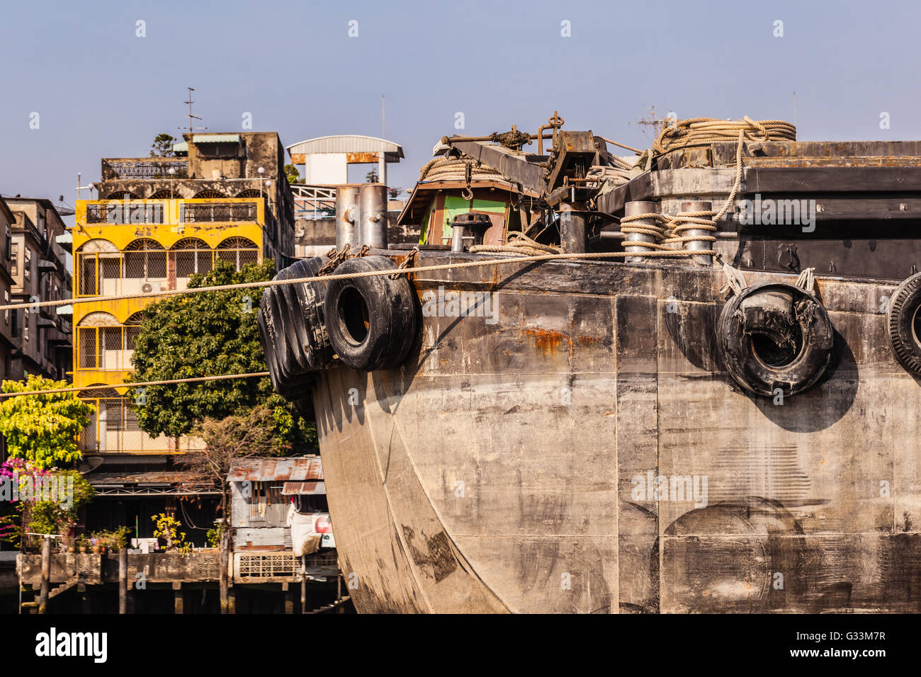 a very big barge floating on Chao Praya River in Bangkok, Thailand ...