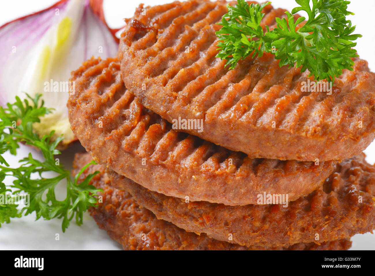 stack of roasted hamburger patties - detail Stock Photo - Alamy
