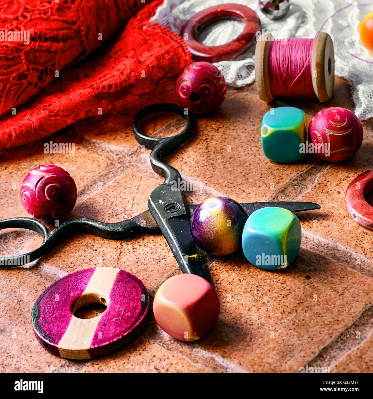 Set for needlework from thread and beads on a stone background Stock ...