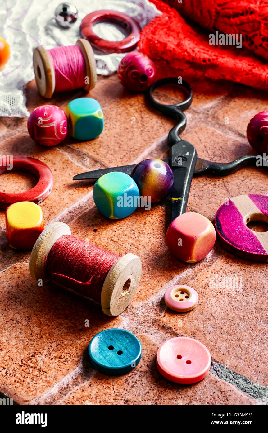 Set for needlework from thread and beads on a stone background Stock ...