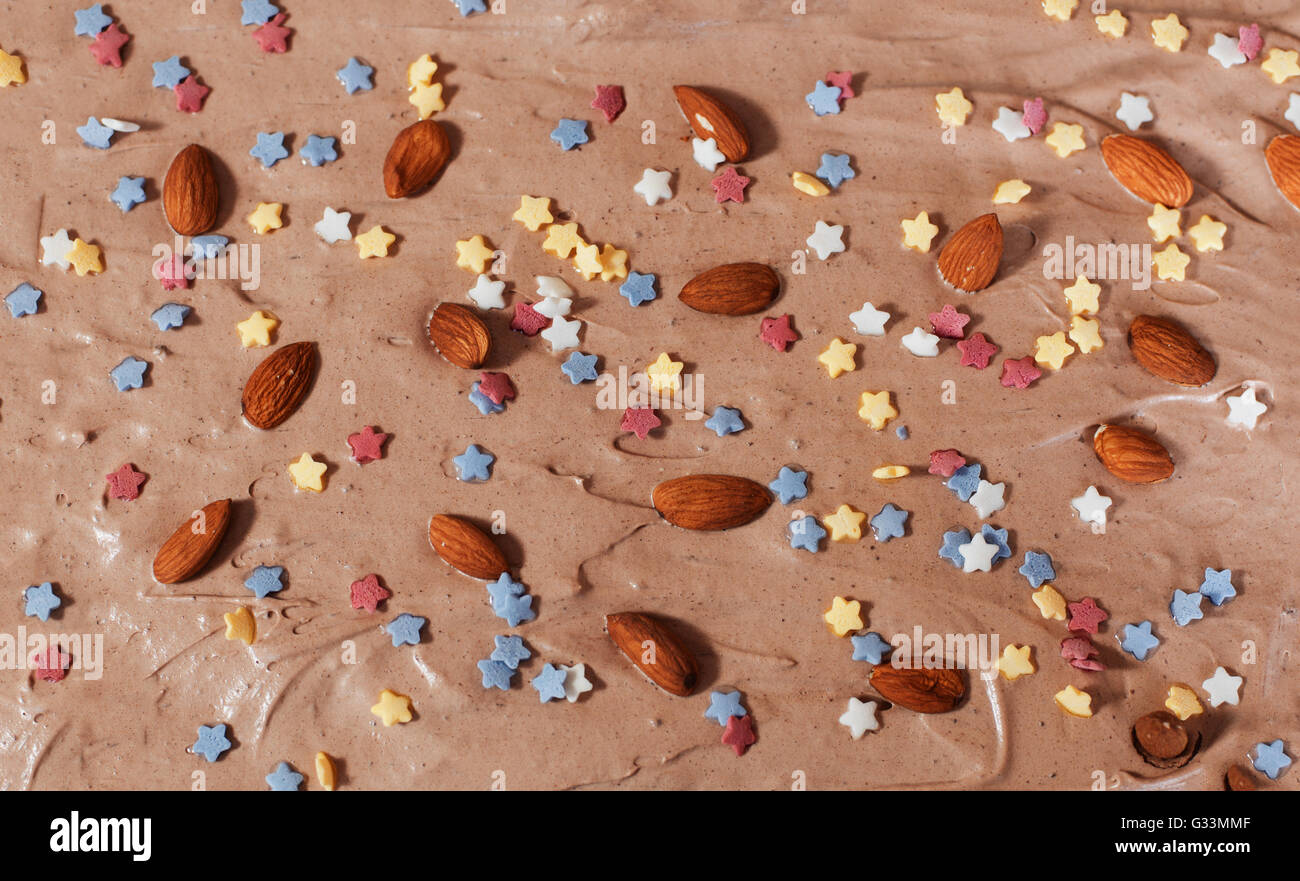 Close/up of chocholate cake with almonds and candies on top, birthday ...