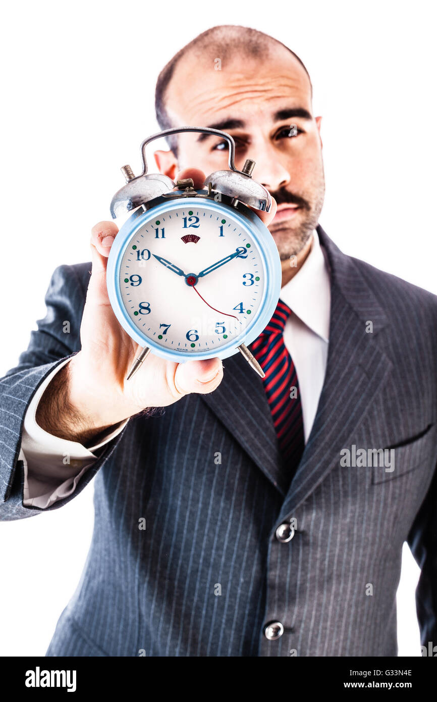 portrait of a businessman with an old and classic alarm clock isolated ...