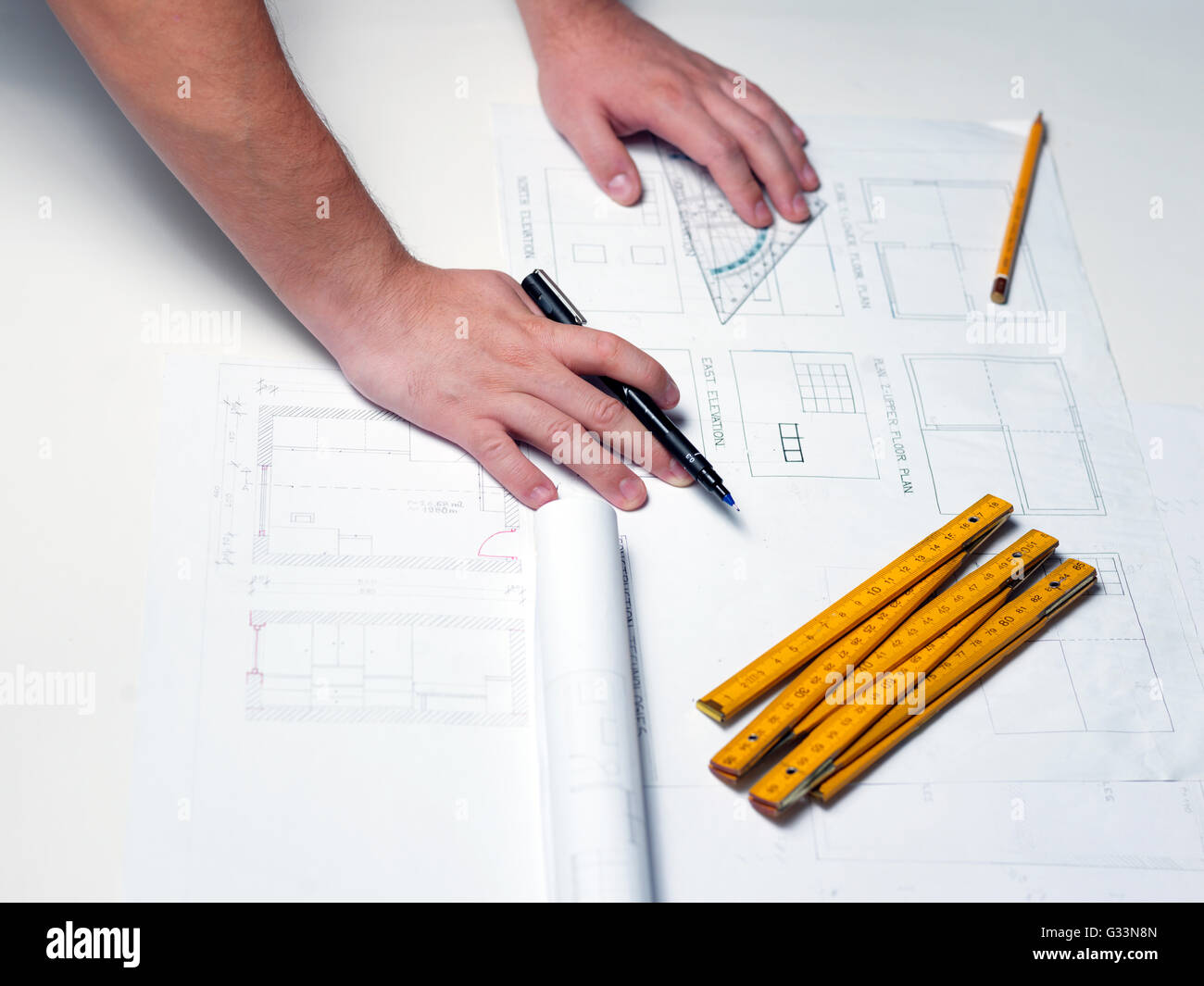 Business man draw buildings and present his architectural project Stock ...