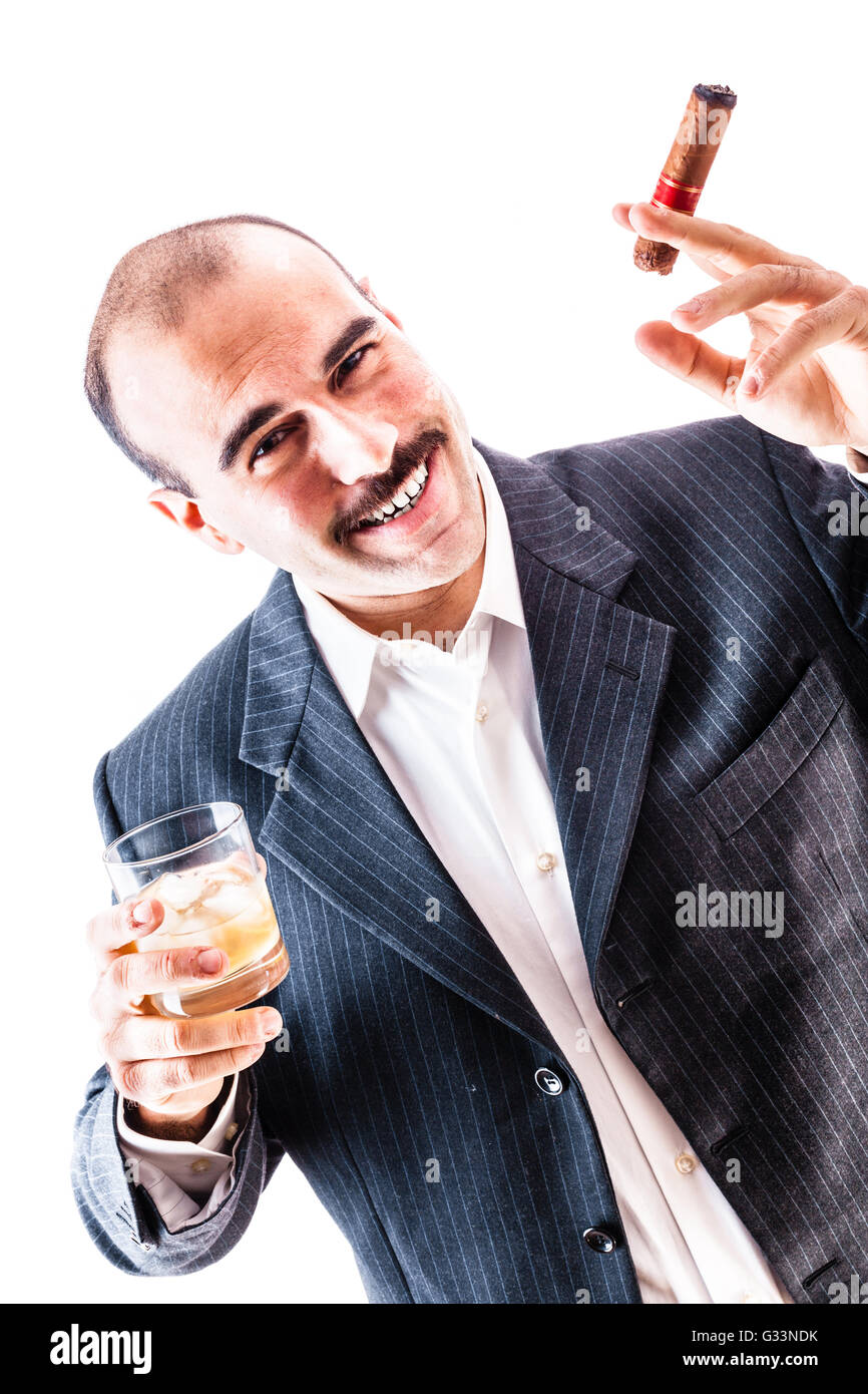 portrait of a classy businessman toasting with a glass of whiskey and ...