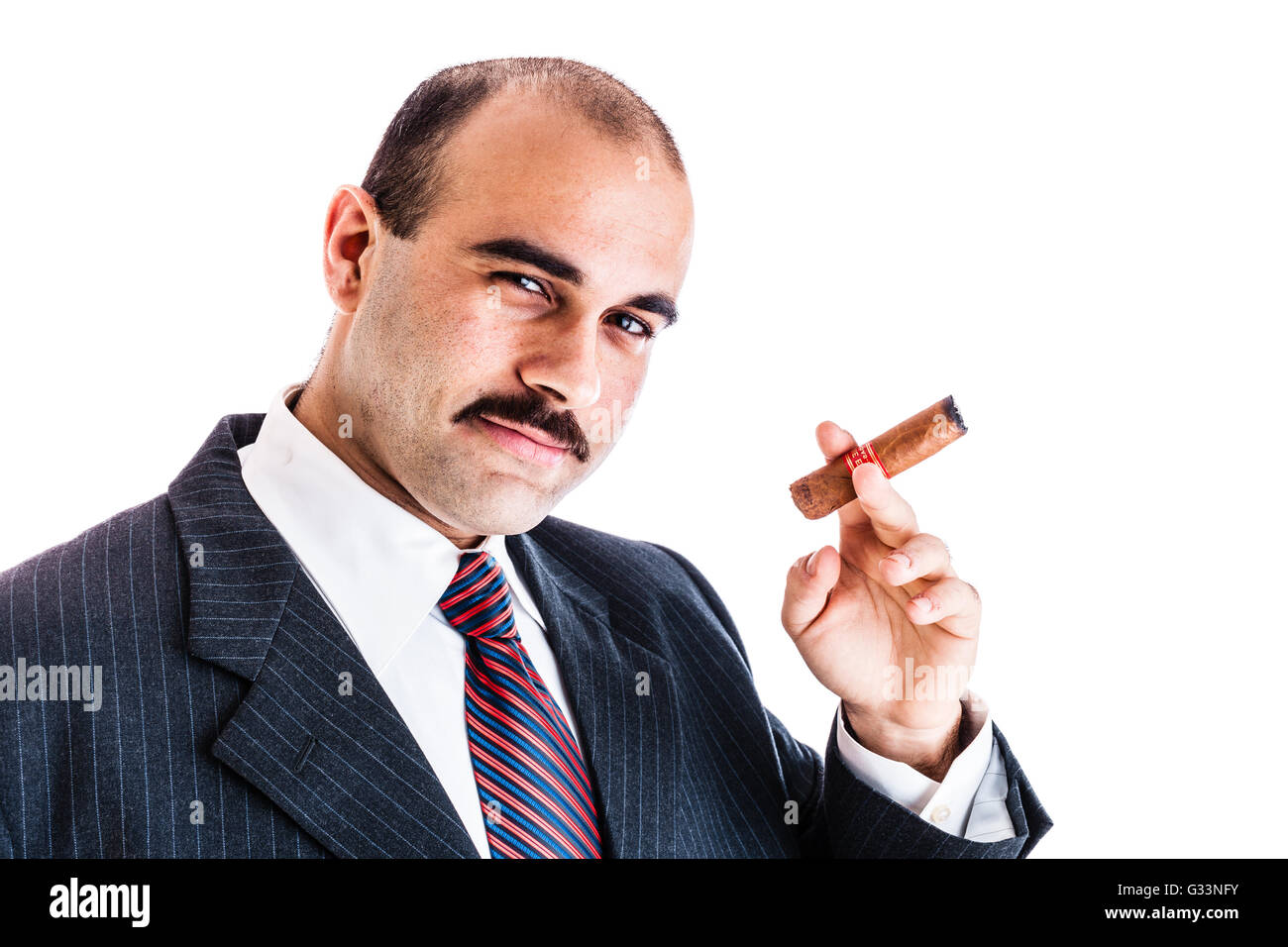 portrait of a rich businessman smoking a big cigar isolated over a ...