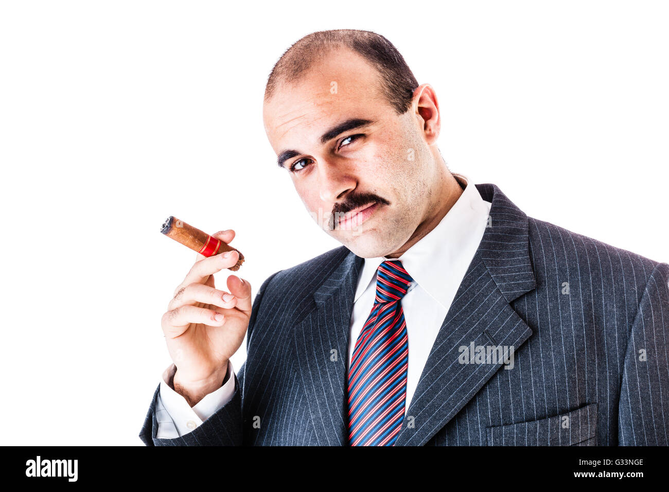 portrait of a rich businessman smoking a big cigar isolated over a ...