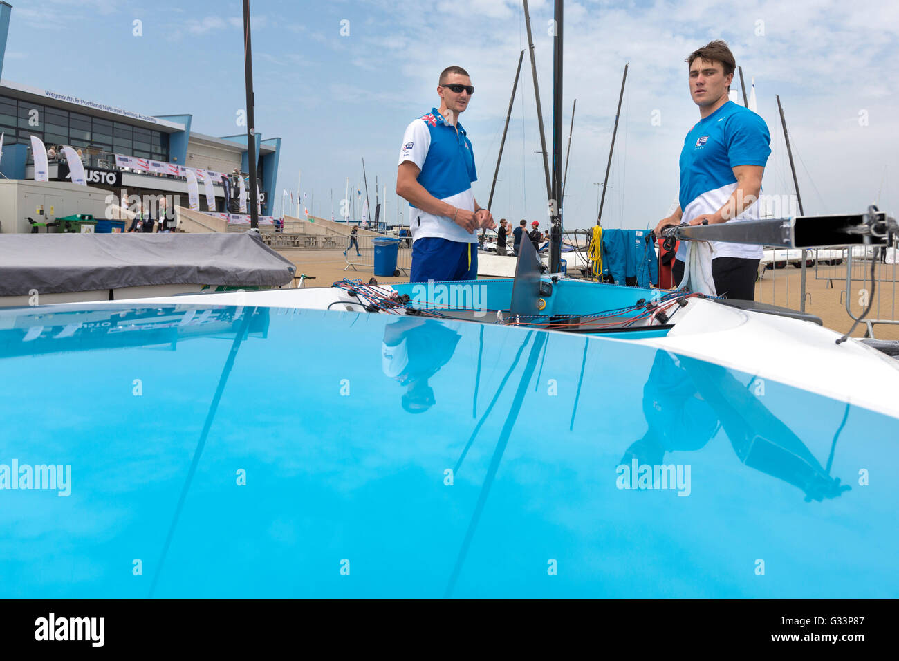 Giles Scott (left) and Ben Cornish prepare Cornish's Finn dinghy at the ...