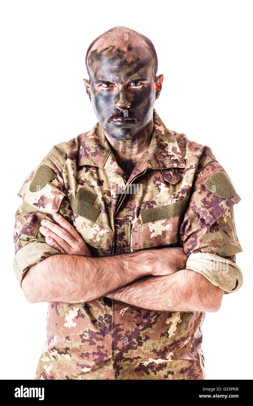 a soldier wearing camouflage clothing and army face paint isolated over ...