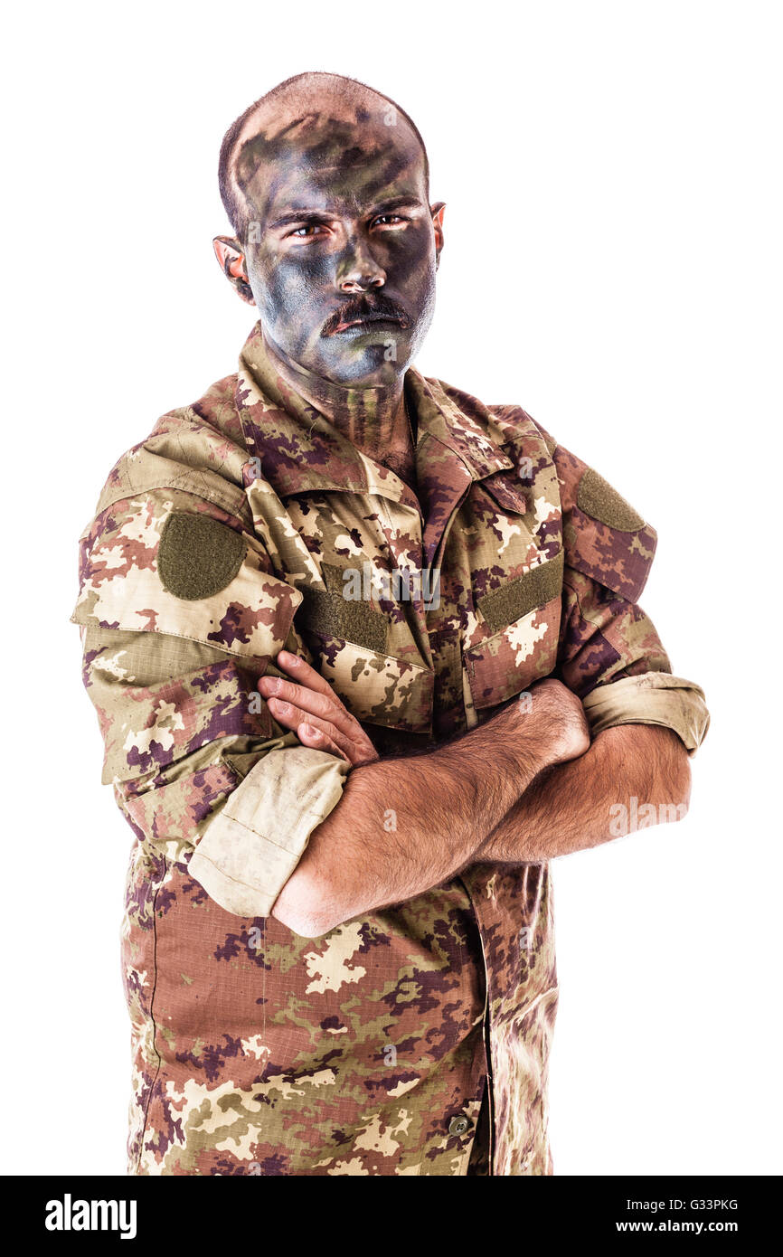 a soldier wearing camouflage clothing and army face paint isolated over ...