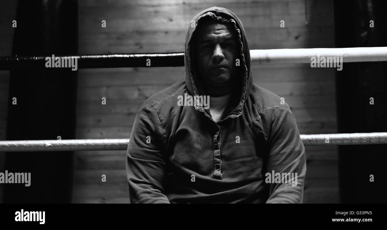 fighter poses in ring and training space Stock Photo - Alamy