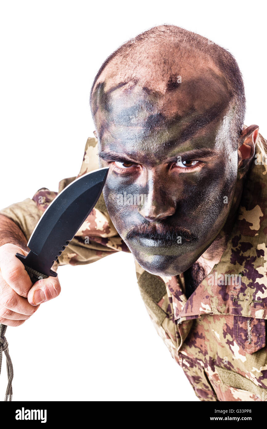 a soldier wearing camouflege clothing and army face paint isolated over ...