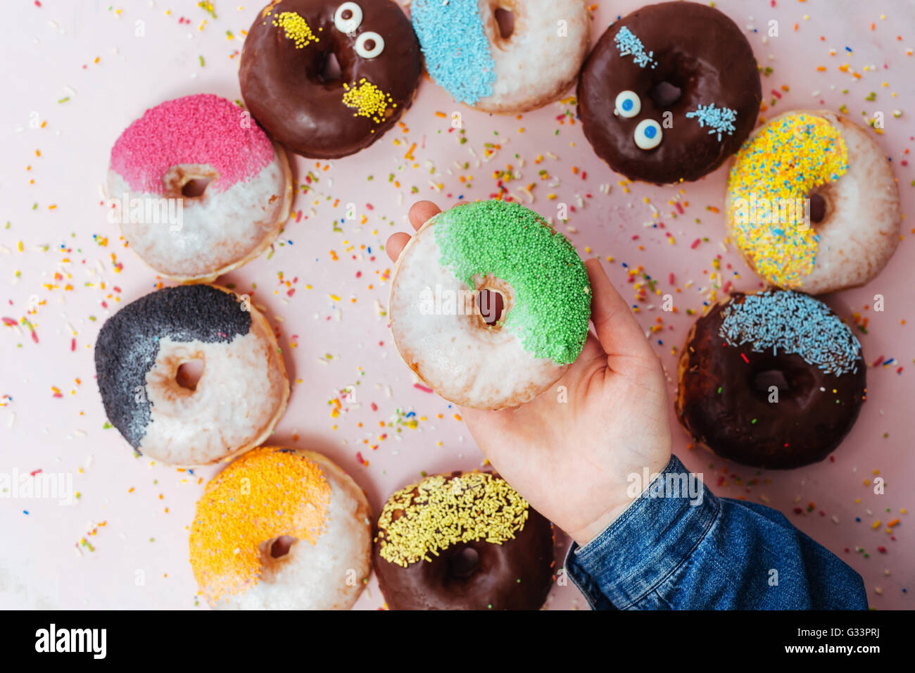 female hand reaching to grab the doughnut Stock Photo - Alamy