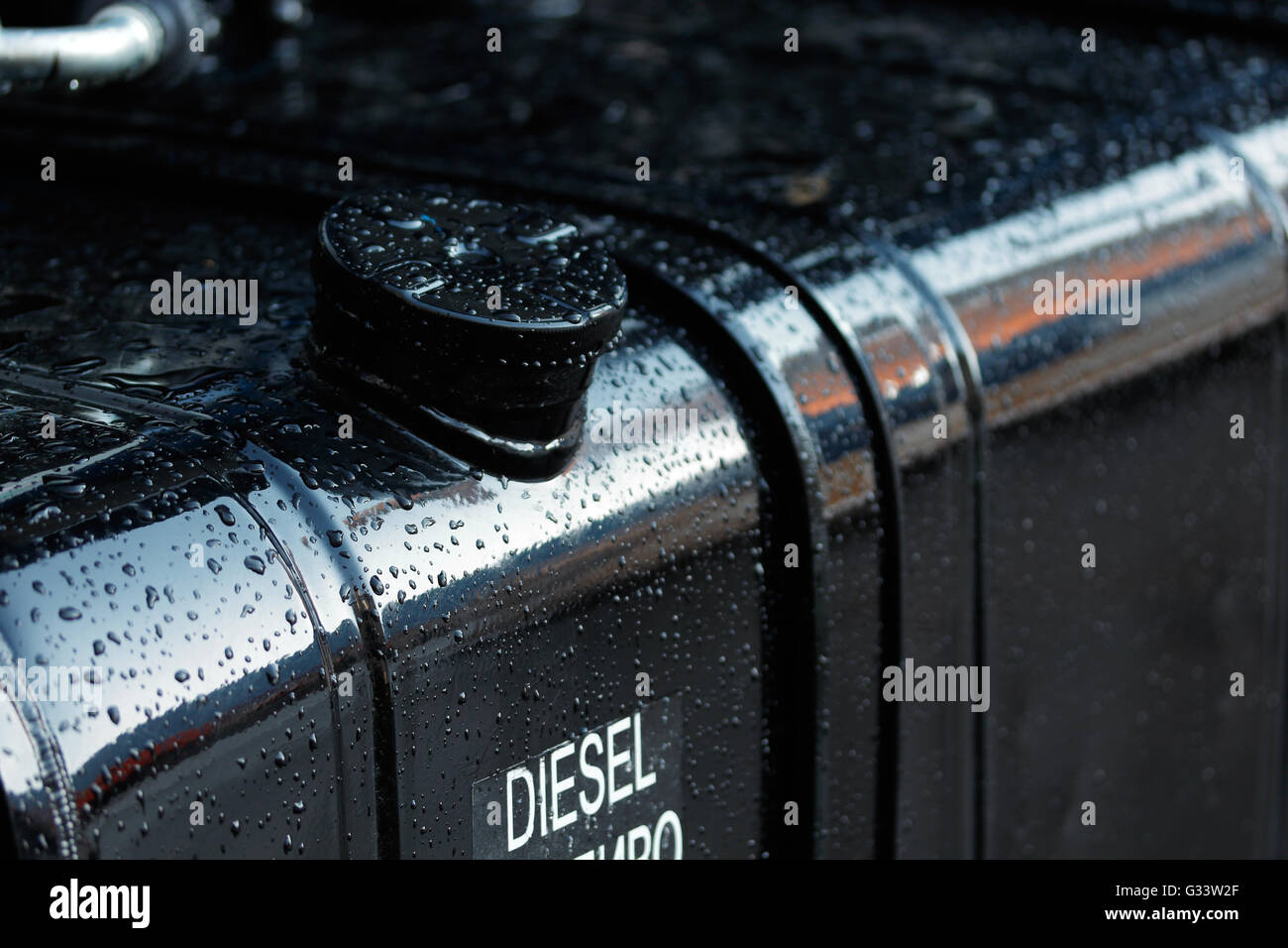 Fuel tank of diesel truck after the rain. Close up view Stock Photo - Alamy