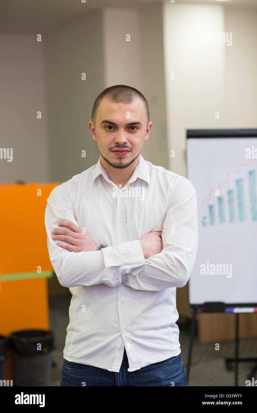 standing confident man in modern office Stock Photo - Alamy